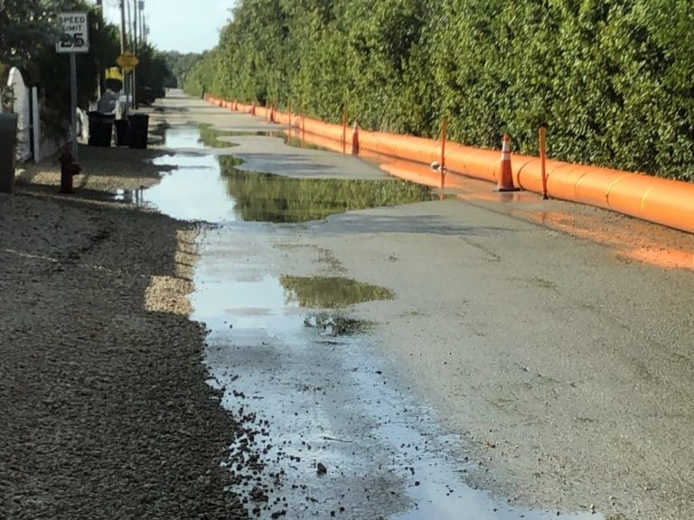 Barriers mitigating flooding in one Key Largo community