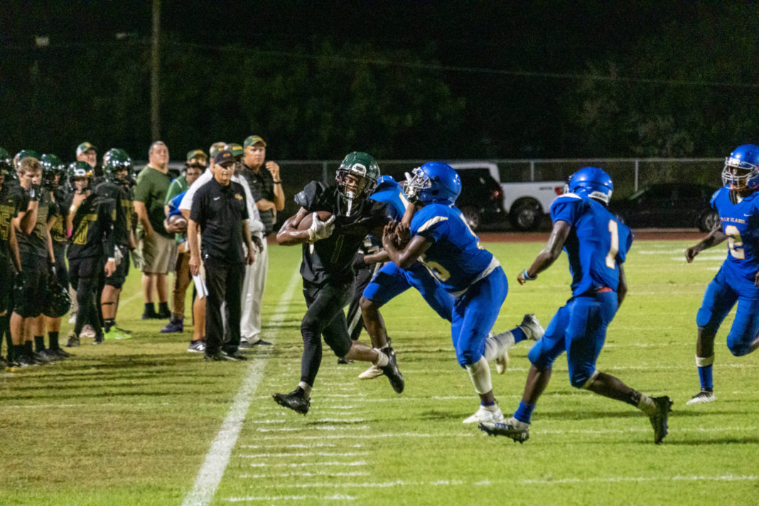 IN PICTURES: ’CANES VARSITY FOOTBALL CLOBBERS PALM GLADES