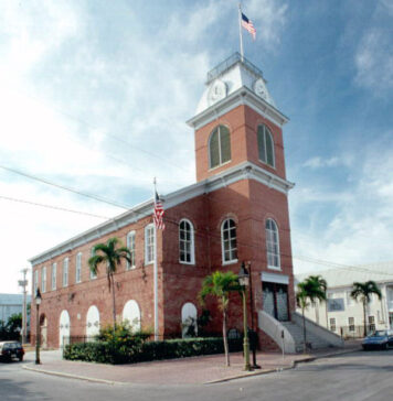 CREWS REPLACE 4-SIDED CLOCK ATOP KEY WEST'S OLD CITY HALL